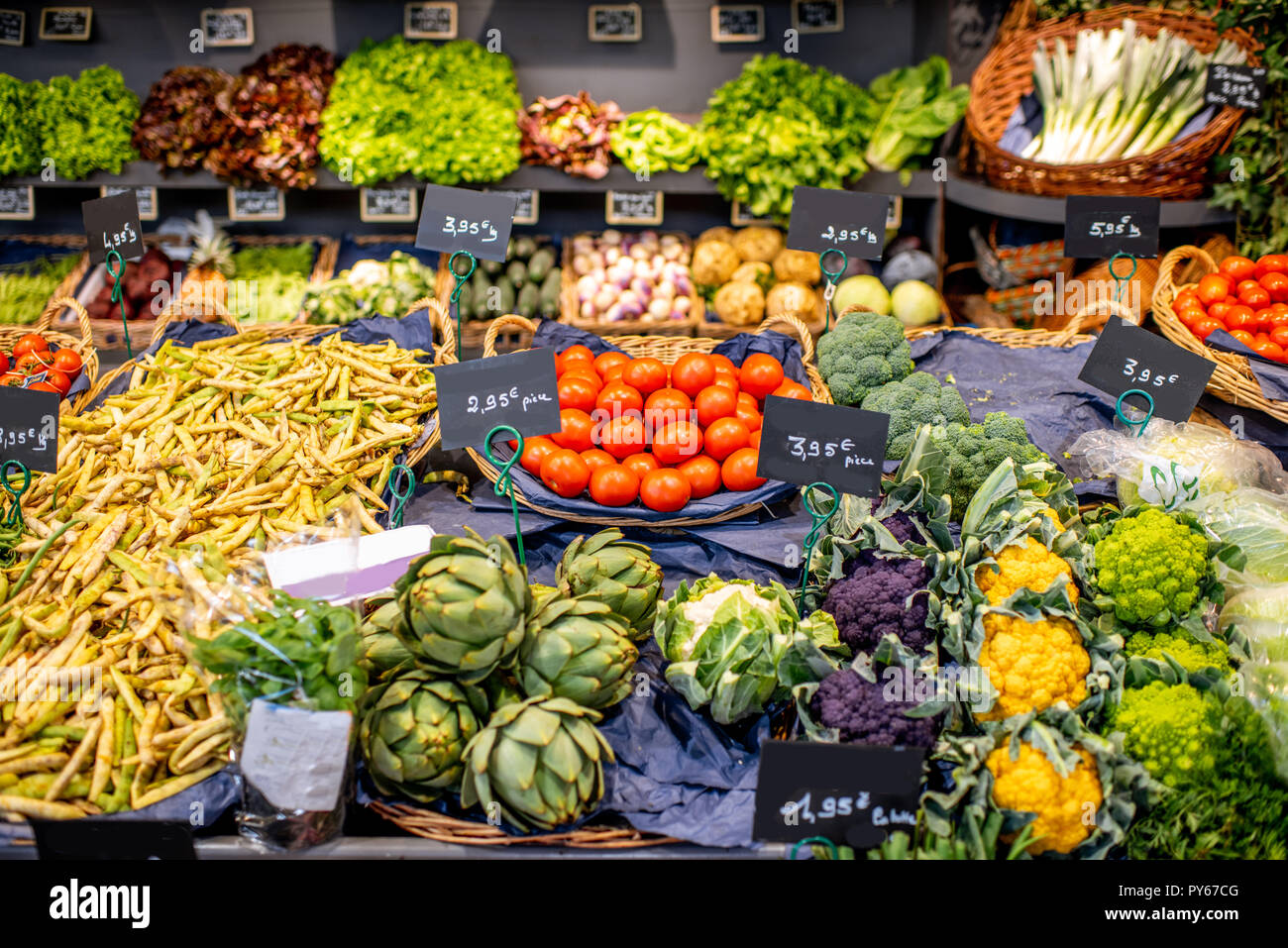 Variety of beautifully organized fruits and vegetables on the counter ...