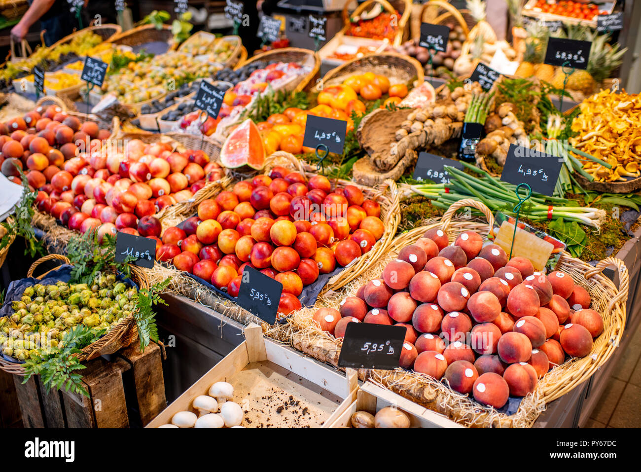Variety of beautifully organized fruits and vegetables on the counter ...