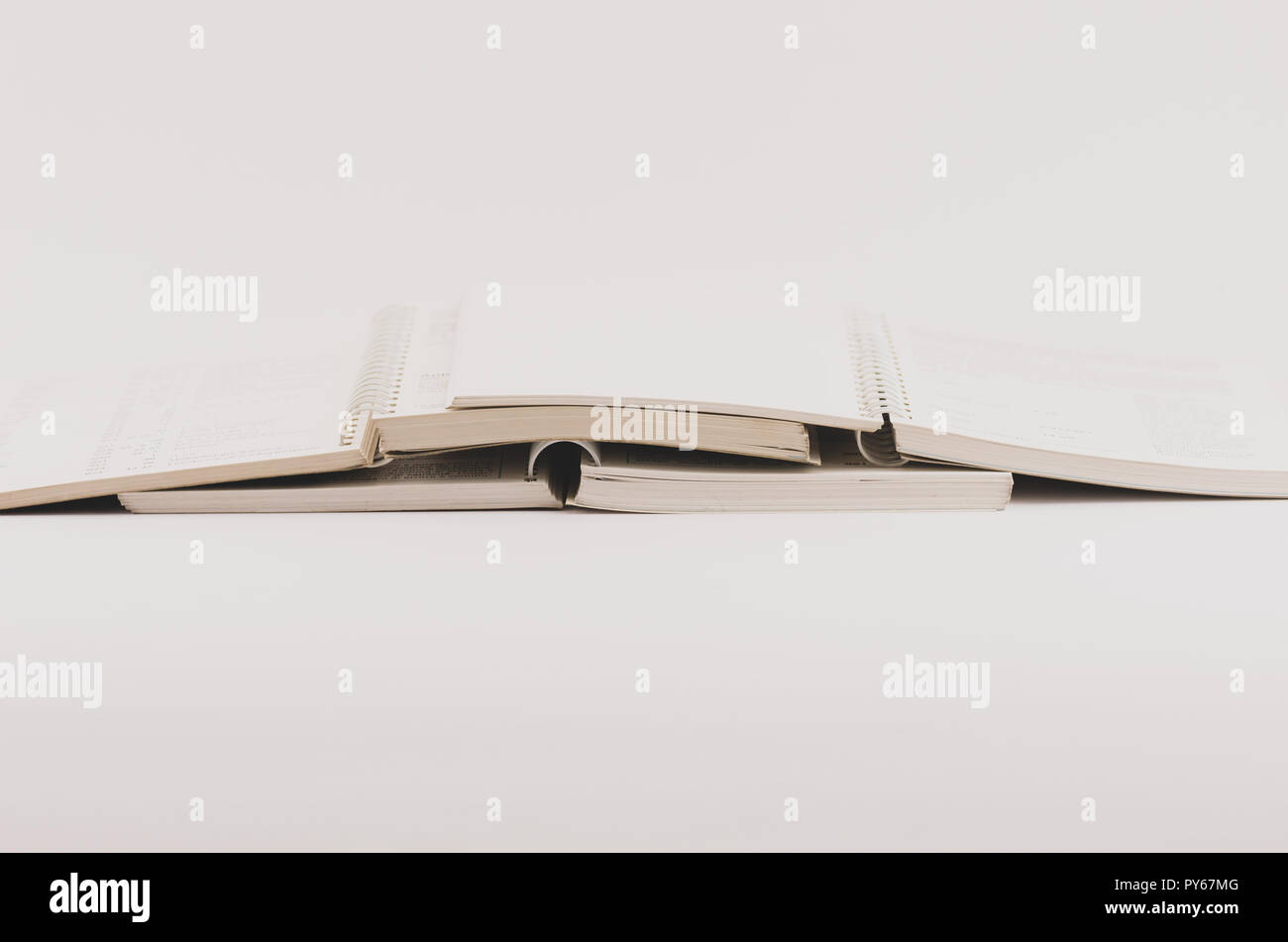 books and manuals on a white background - reading and culture concept ...