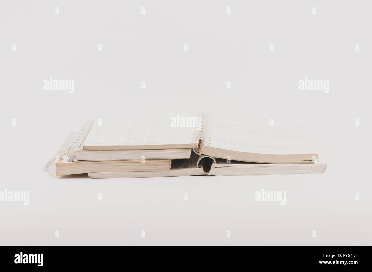 books and manuals on a white background - reading and culture concept ...
