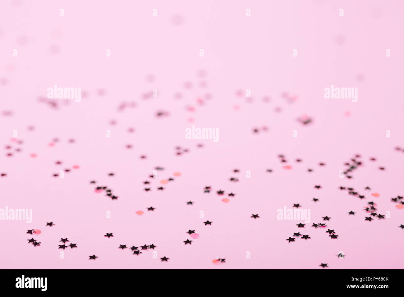 Pink background with multicolored sparkles on it. Festive concept Stock ...