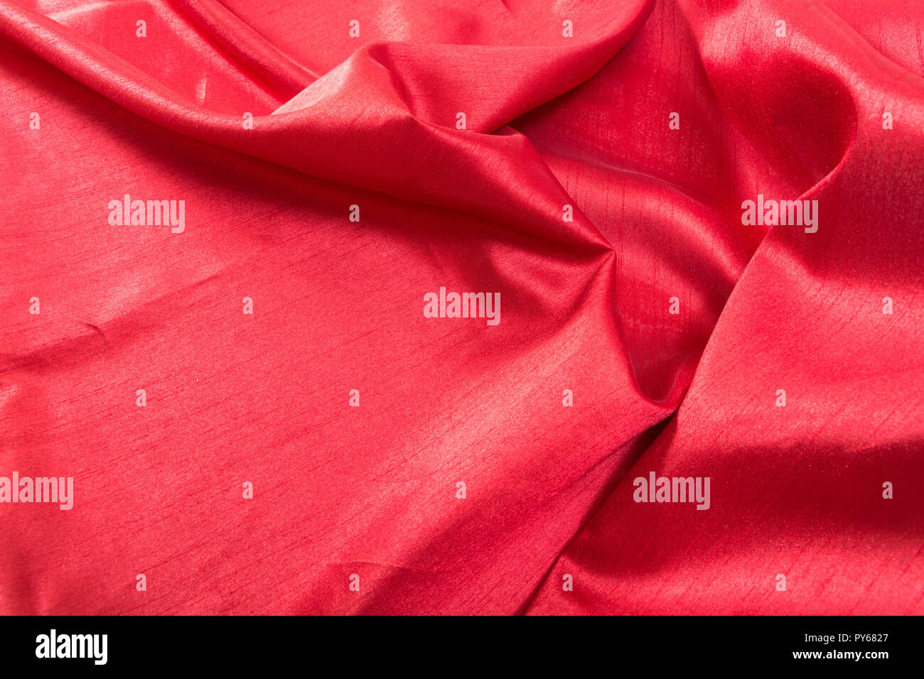 Rich red wavy fabric texture / background Stock Photo - Alamy