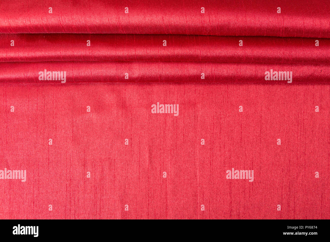 Rich red wavy fabric texture / background Stock Photo - Alamy