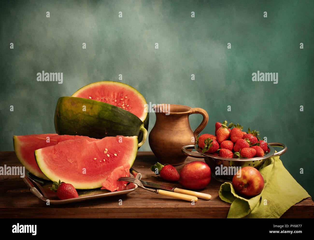 Beautiful still life with different fruits. Still life in red-green ...