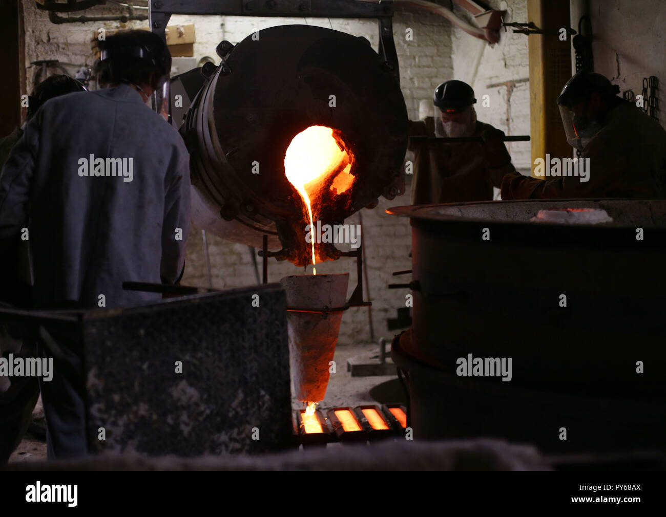 Foundry workers during the casting of Our Emmeline, a bronze statue of ...