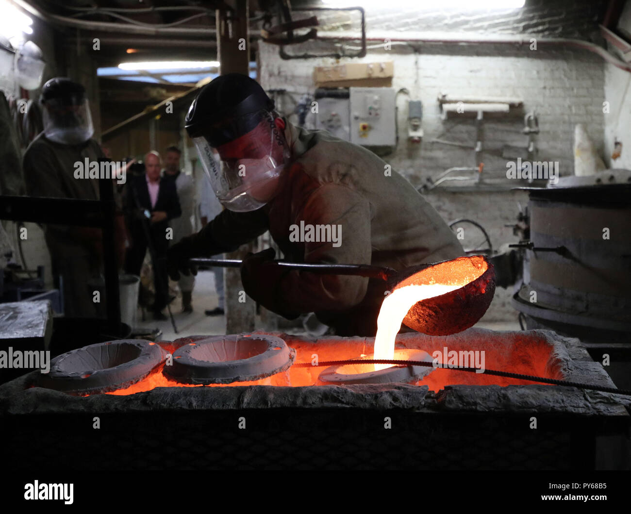 Foundry workers during the casting of Our Emmeline, a bronze statue of ...