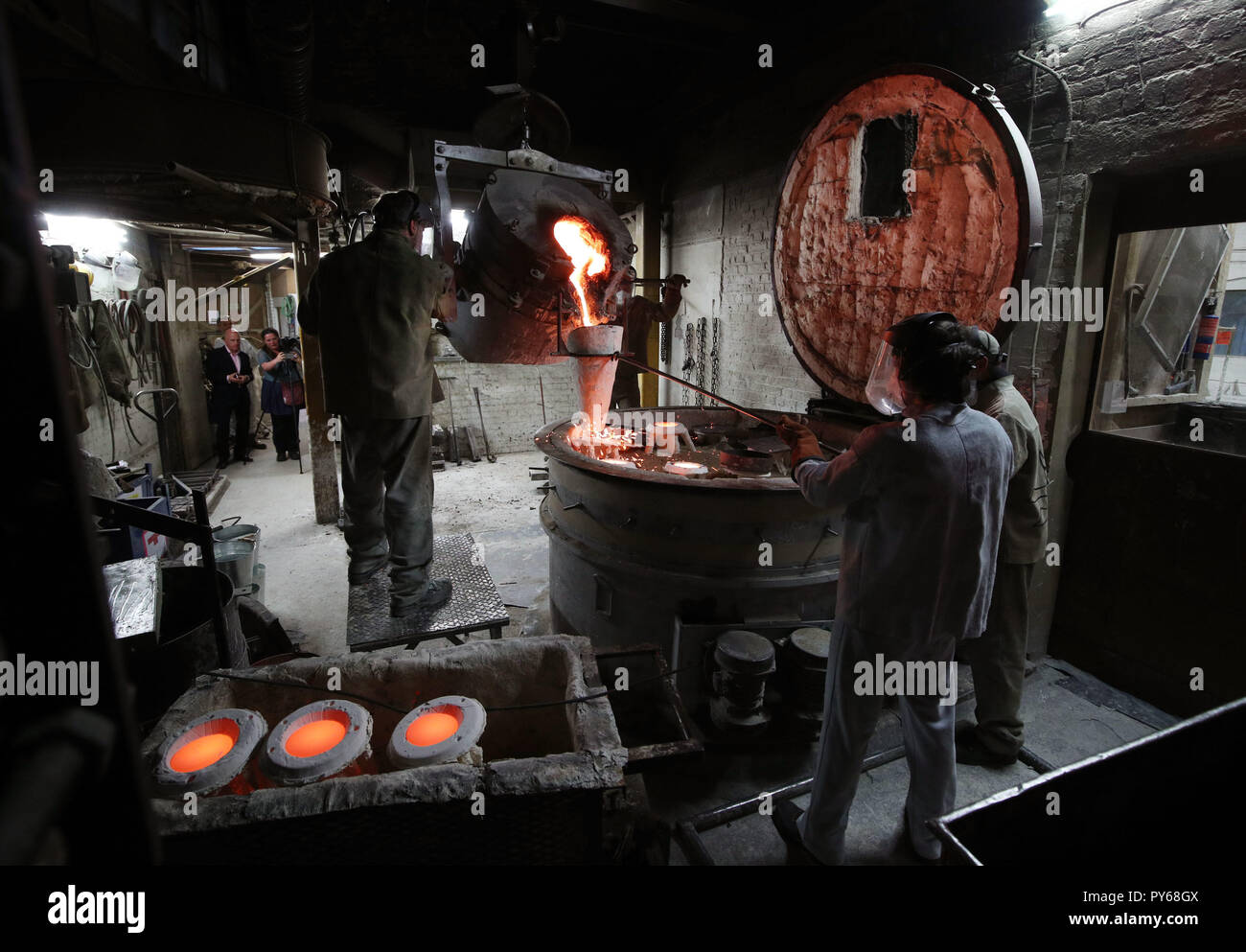 Foundry workers during the casting of Our Emmeline, a bronze statue of ...