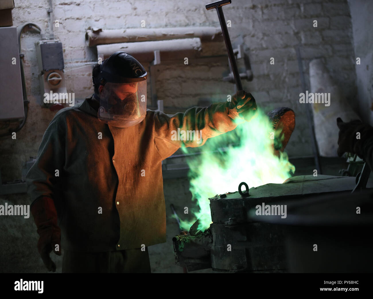 A foundry worker during the casting of Our Emmeline, a bronze statue of ...