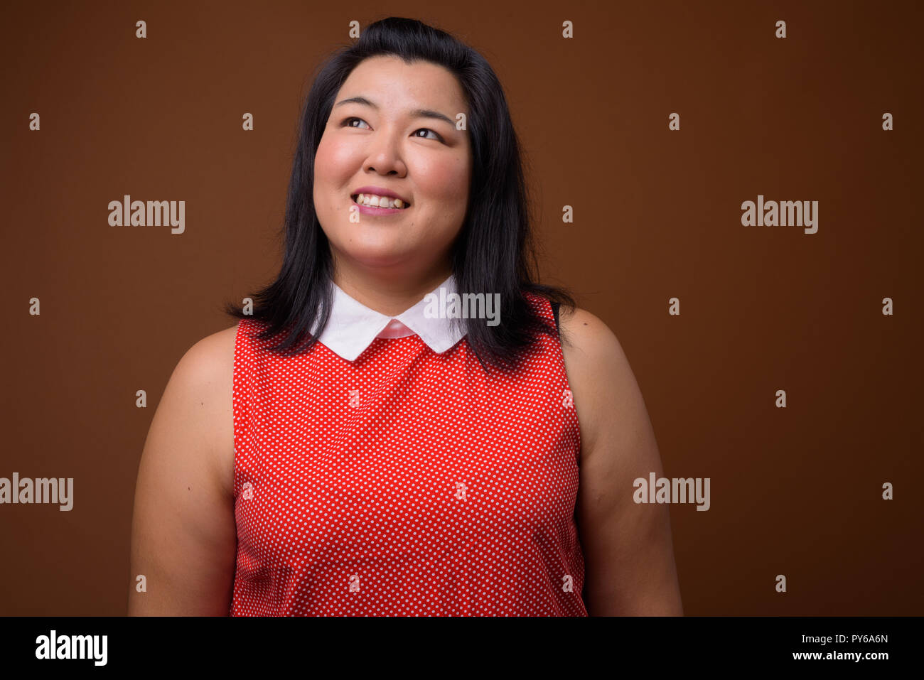 Happy overweight asian woman thinking hi-res stock photography and ...