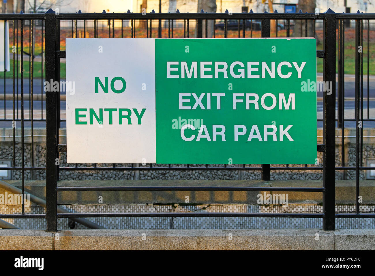 Emergency exit from car park sign board Stock Photo - Alamy