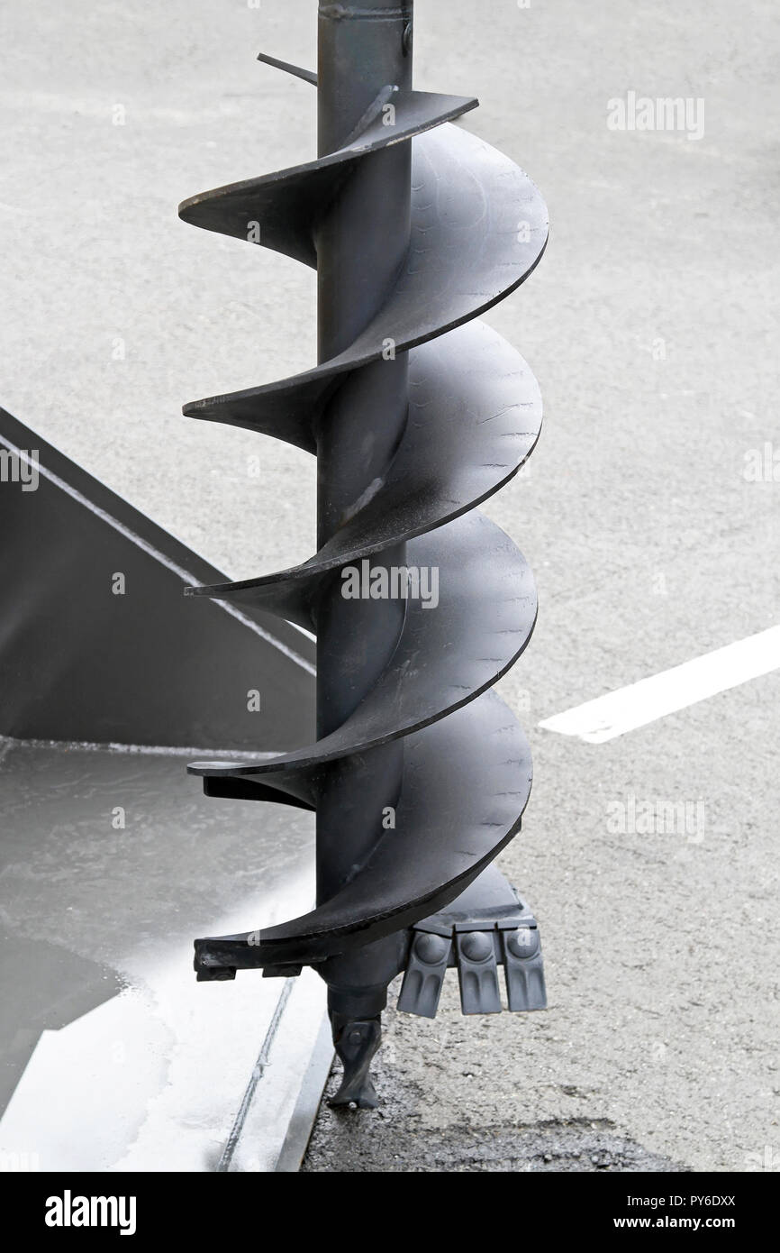 Construction machinery with big black drill bit Stock Photo - Alamy