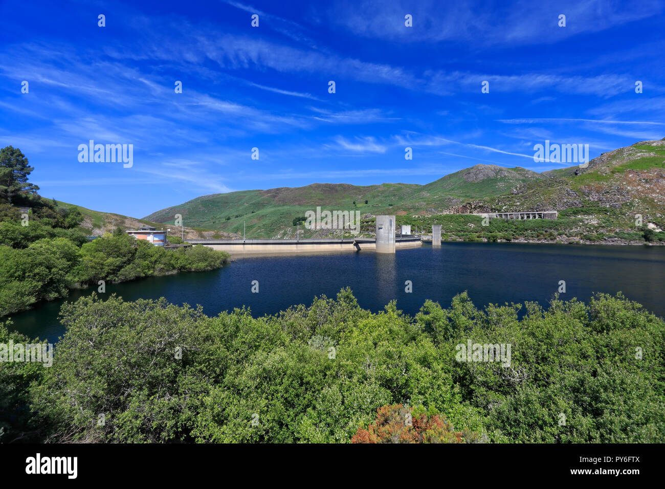 Beautiful small dam from the north of Portugal in spring with deep blue ...