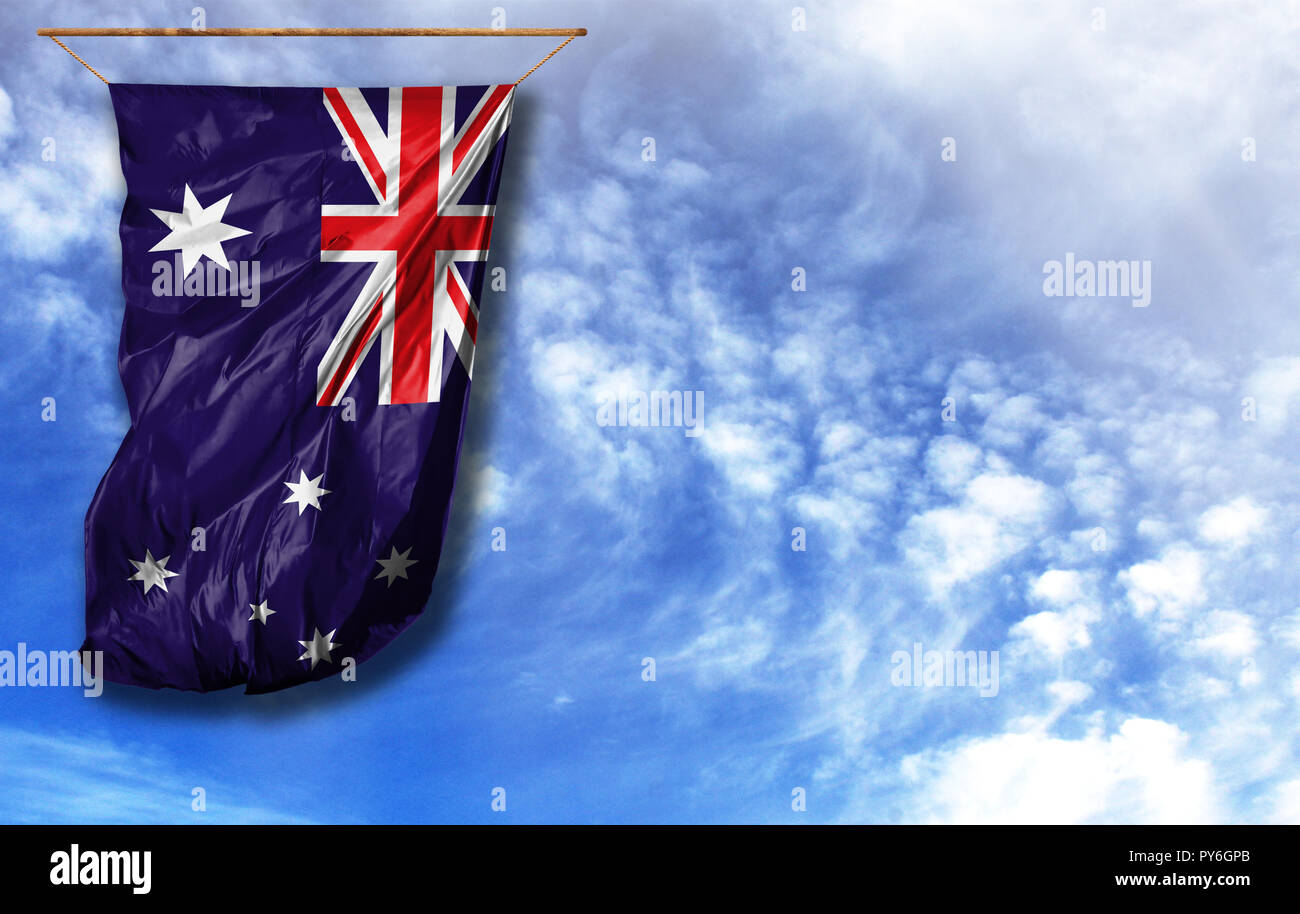 Flag of Australia. Vertical flag, against blue sky with place for your ...