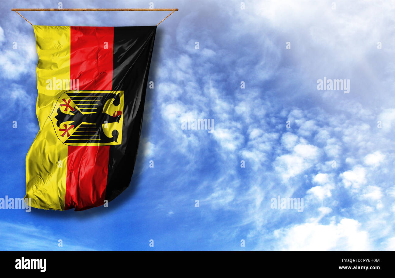 Flag of Germany. Vertical flag, against blue sky with place for your ...