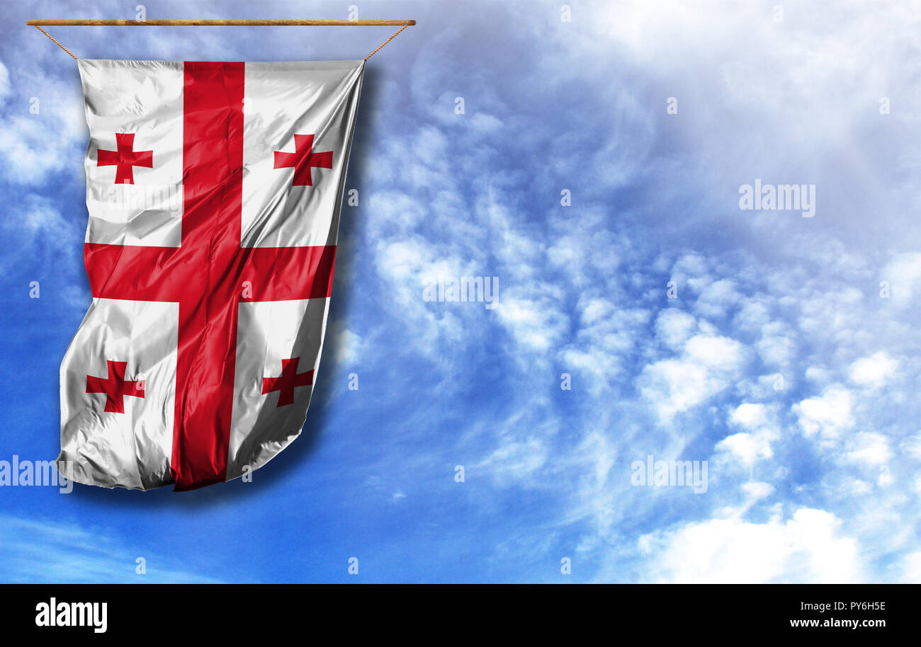 Flag of Georgia. Vertical flag, against blue sky with place for your ...