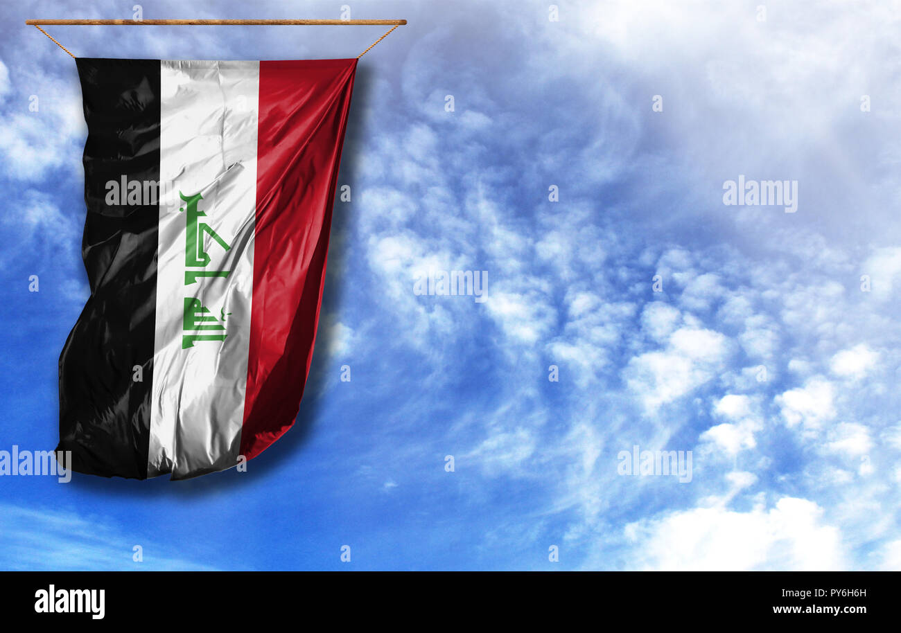Flag of Iraq. Vertical flag, against blue sky with place for your text ...