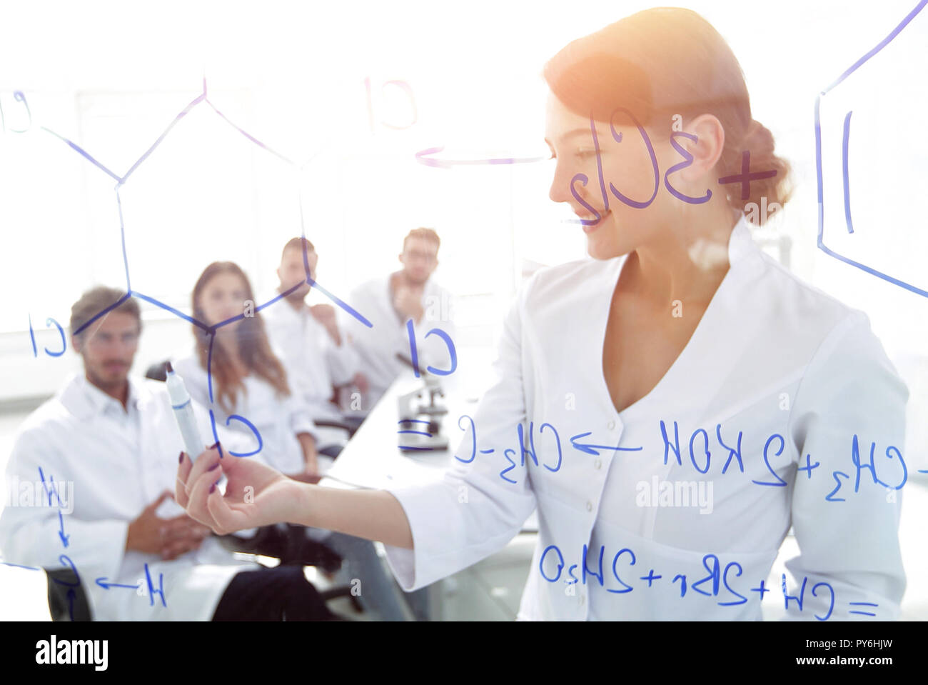 view through the transparent Board. female biochemist analyzing ...