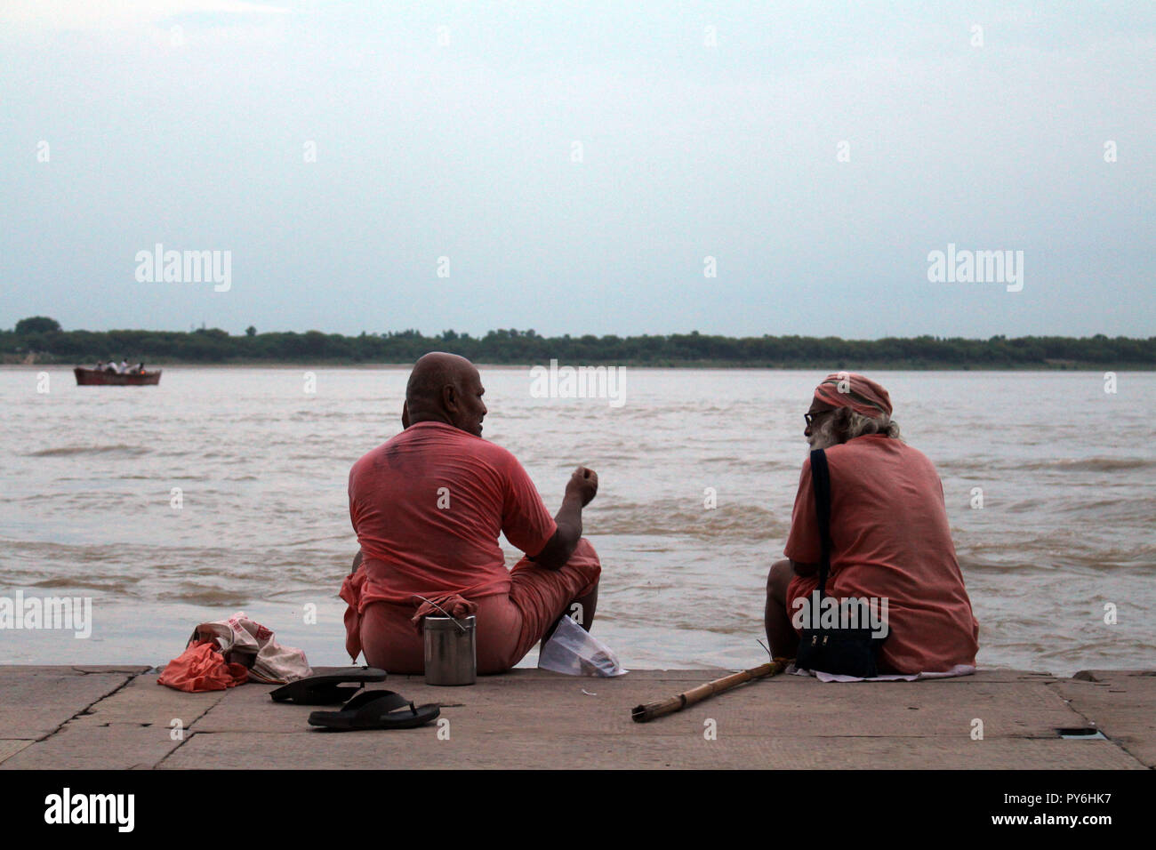 Local people chatting, interacting, hanging around Varanasi ghats in ...