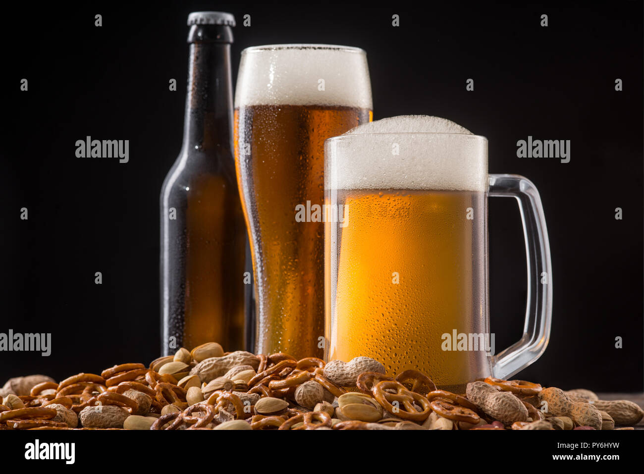 Beer served with snacks Stock Photo - Alamy
