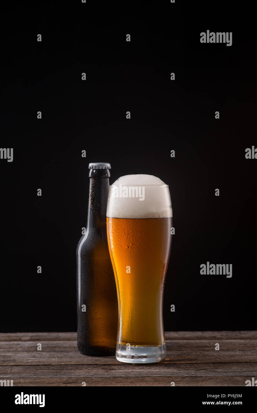 Glass and bottle of ale Stock Photo - Alamy