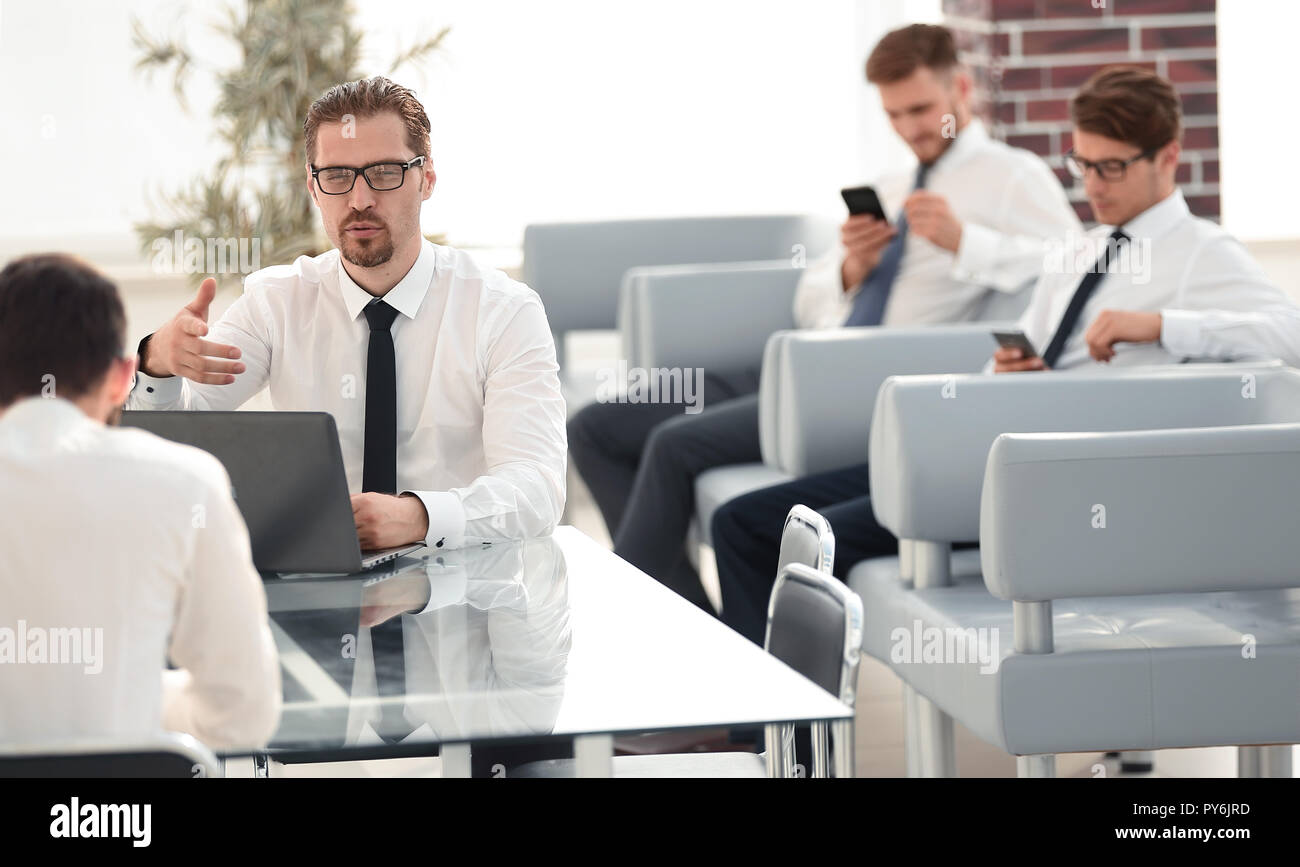 Bank employees in the workplace in the office Stock Photo - Alamy