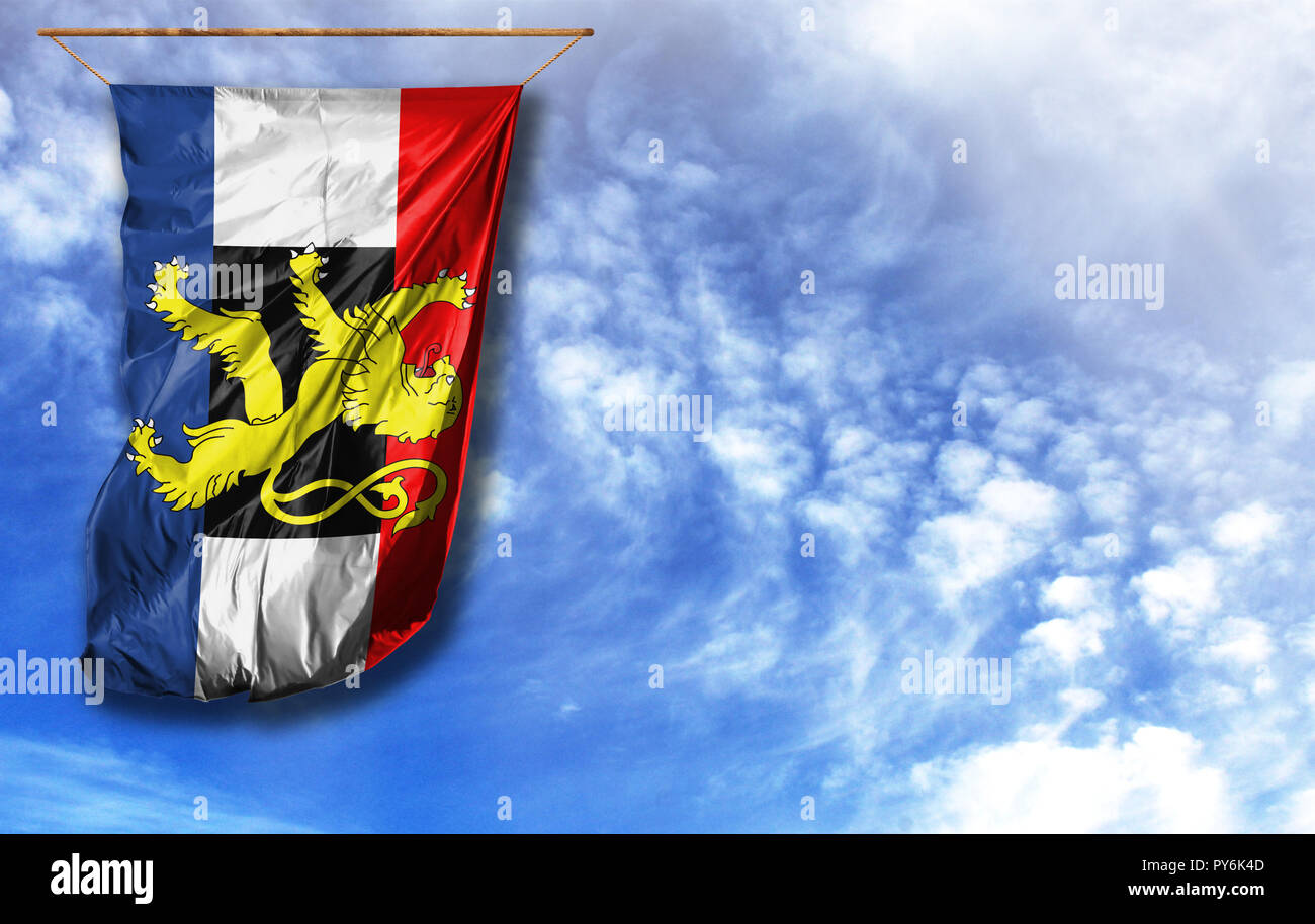 Flag of Benelux. Vertical flag, against blue sky with place for your ...