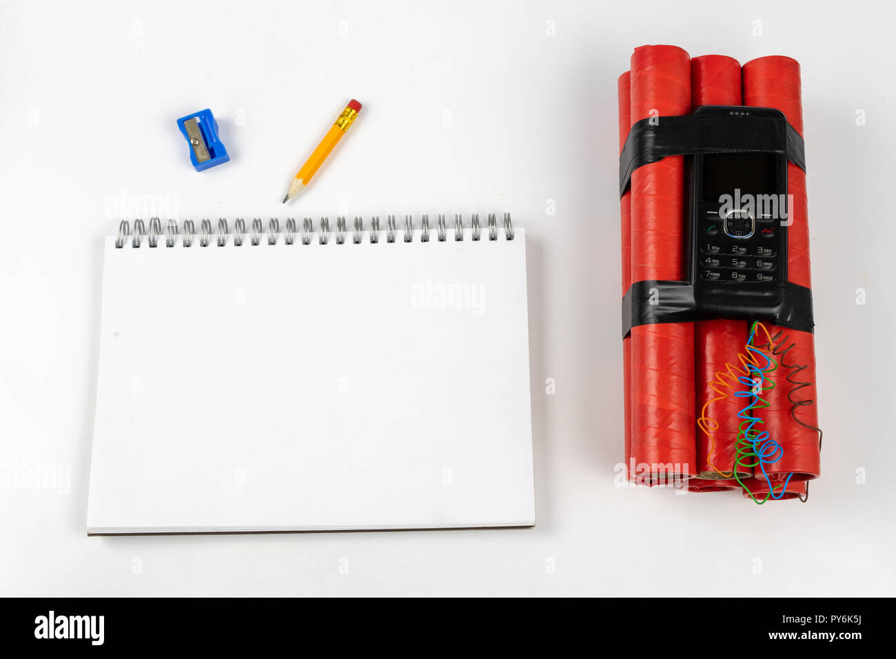 Notebook for taking notes and pencil on the table with explosives ...