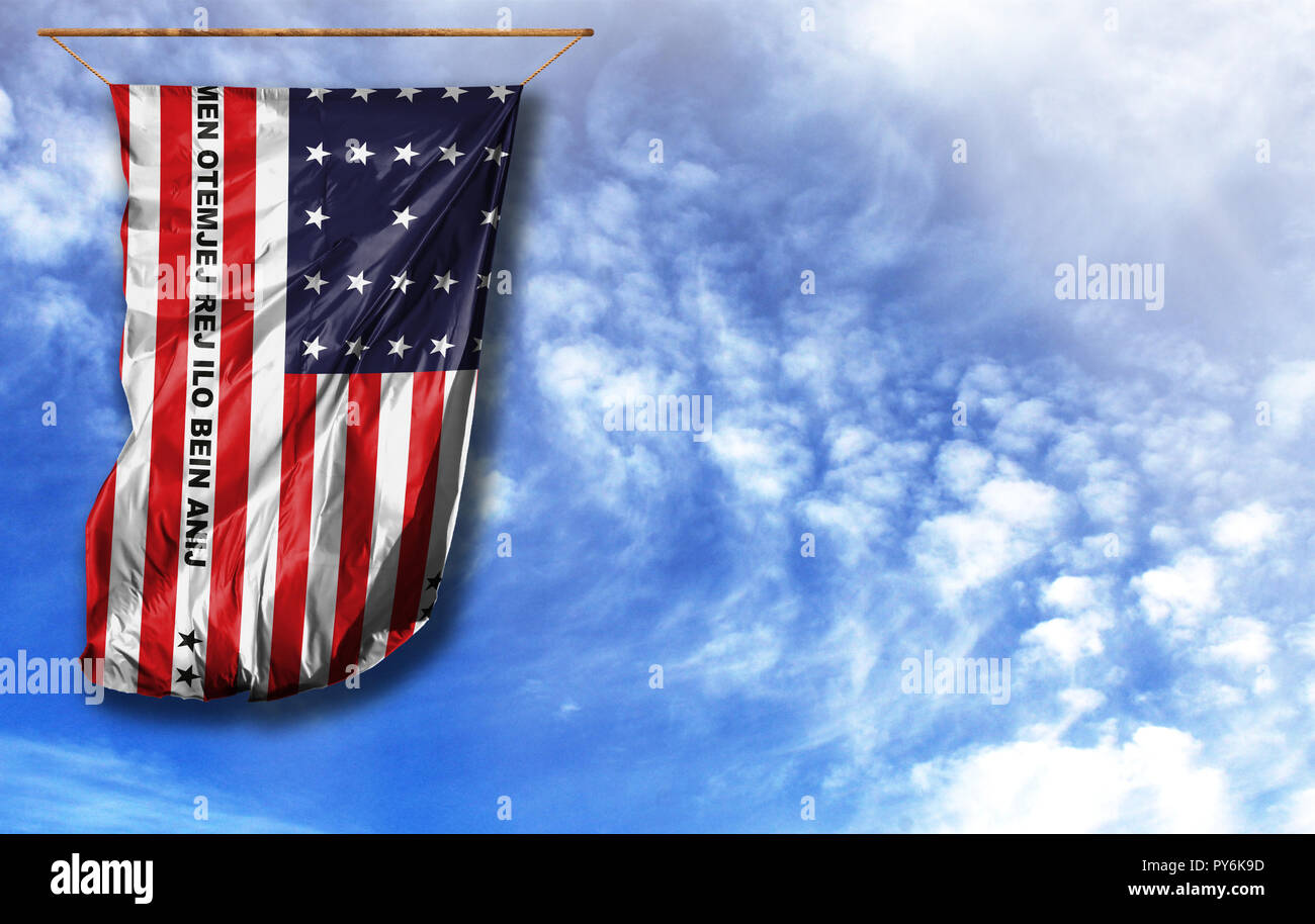 Flag of Bikini Atoll. Vertical flag, against blue sky with place for ...