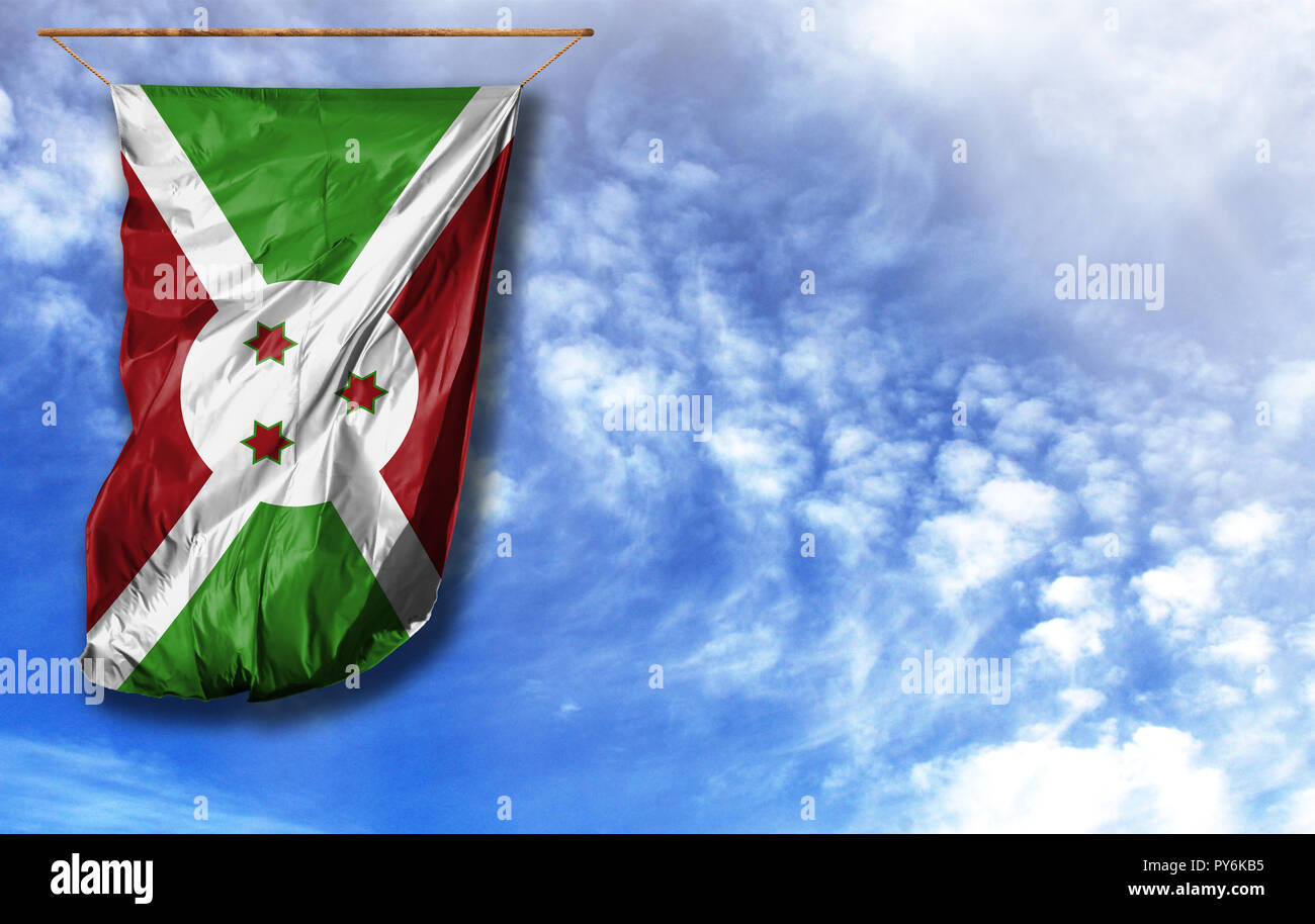 Flag of Burundi. Vertical flag, against blue sky with place for your ...