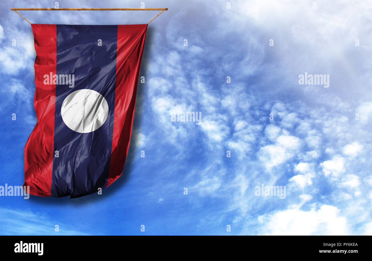 Flag of Laos. Vertical flag, against blue sky with place for your text ...