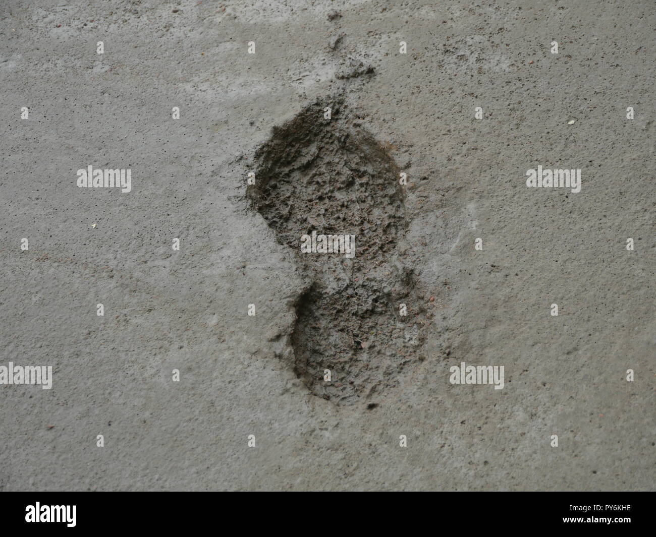 Human footprints in concrete, construction site Stock Photo - Alamy