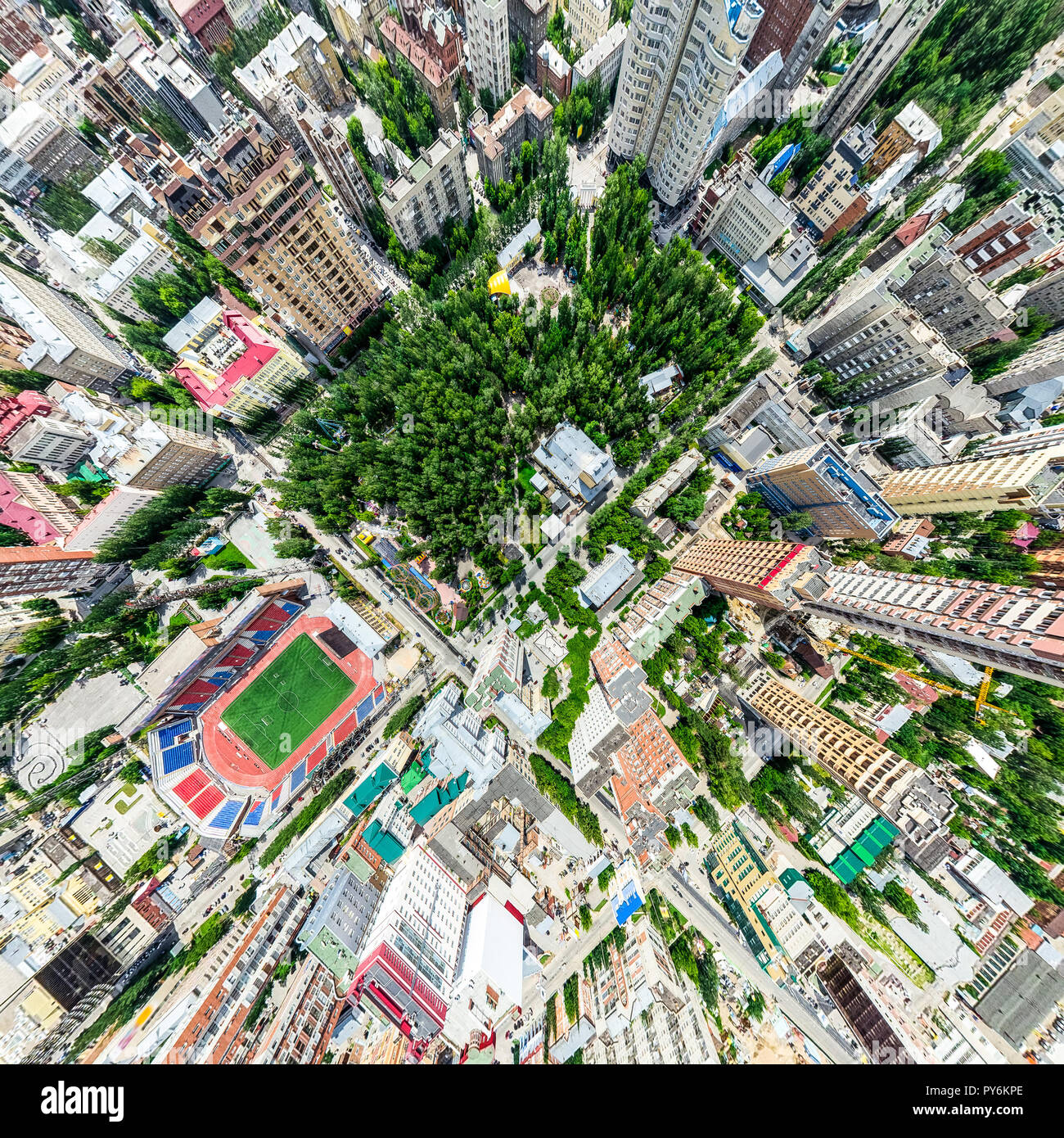Aerial city view with crossroads and roads, houses, buildings, parks ...