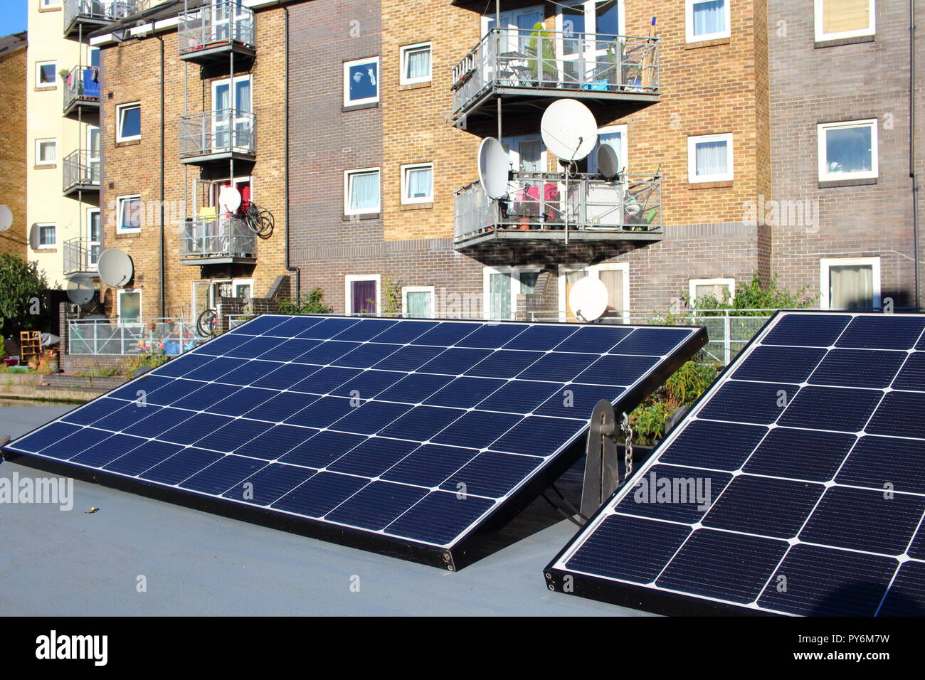Solar cells panels on terrace of building - green energy concept Stock ...