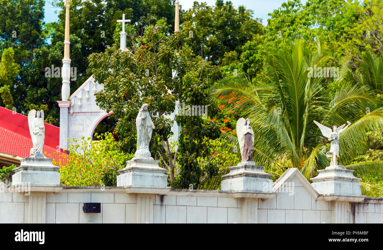 View of the sculptures on the facade of the building in Catholic Simala ...