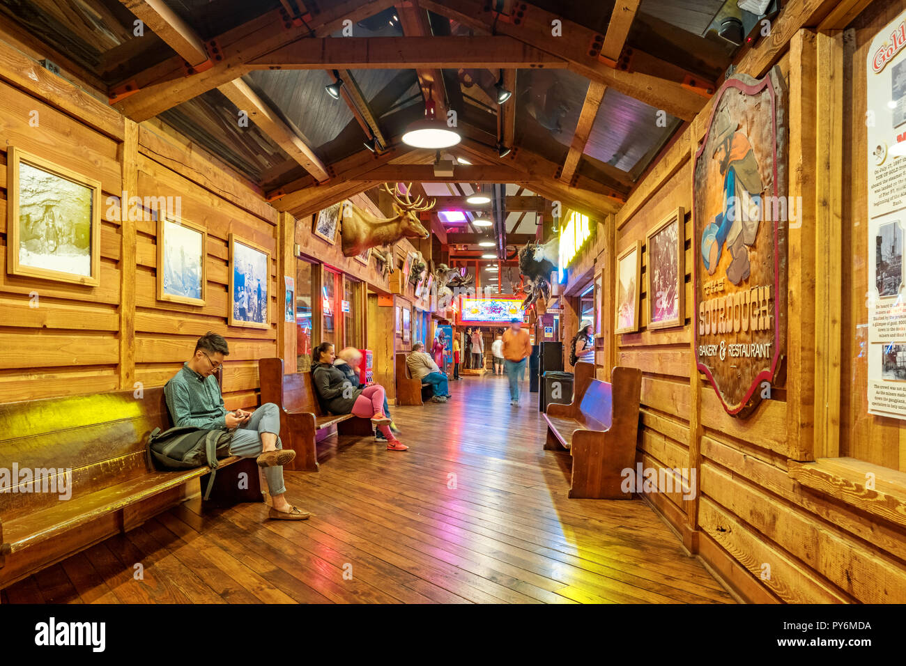 Miners Landing on Pier 57 with restaurant signs in Seattle Washington ...