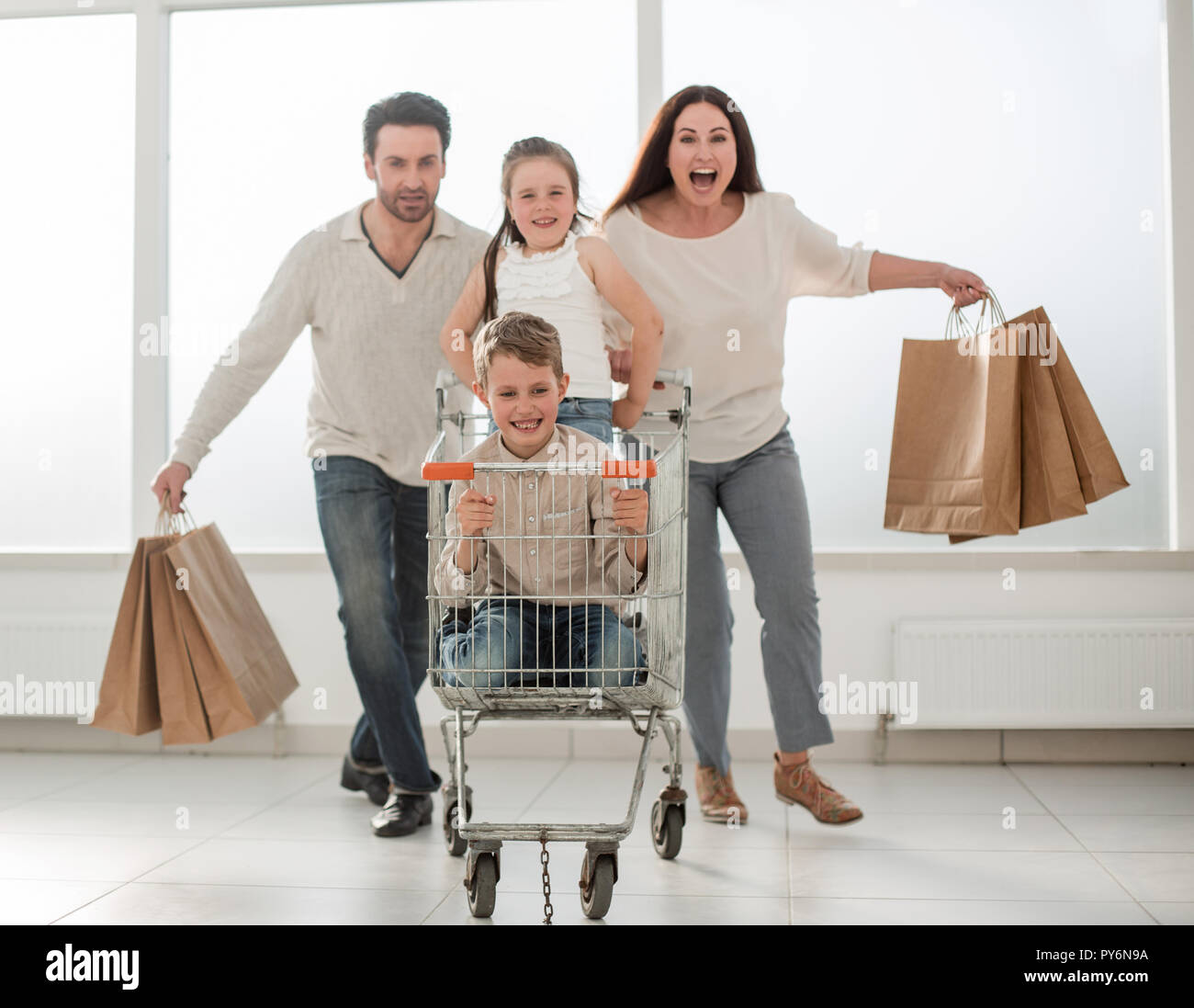 happy family with cart and kids Stock Photo - Alamy