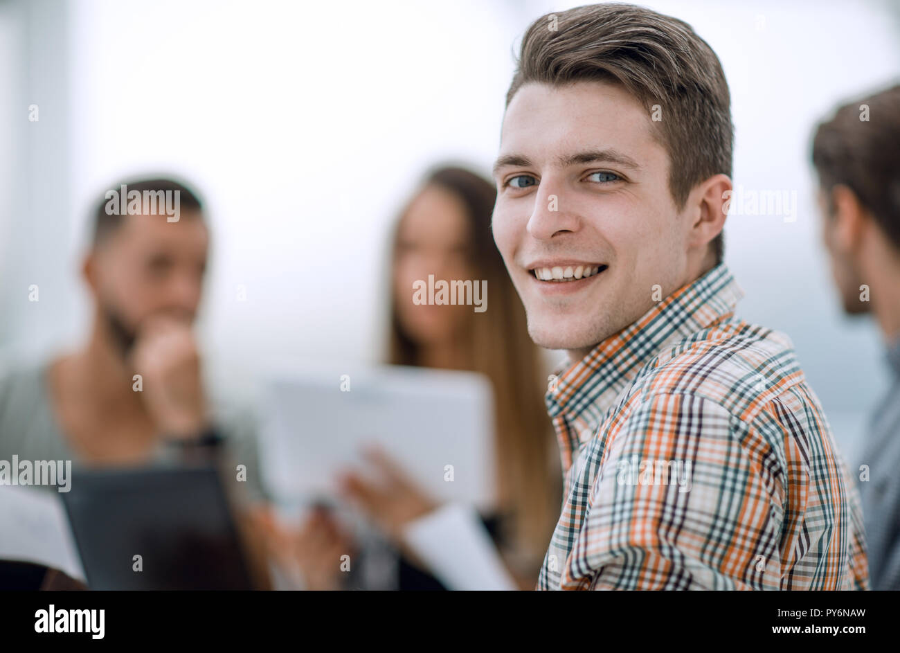 close up.successful employee on the background of the workplace Stock ...