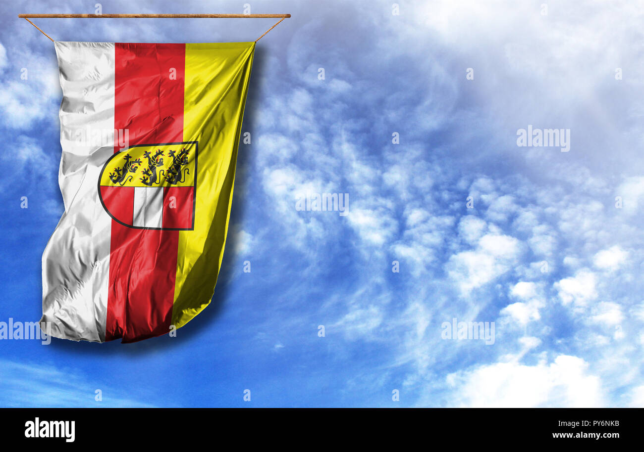 Flag of Carinthia. Vertical flag, against blue sky with place for your ...