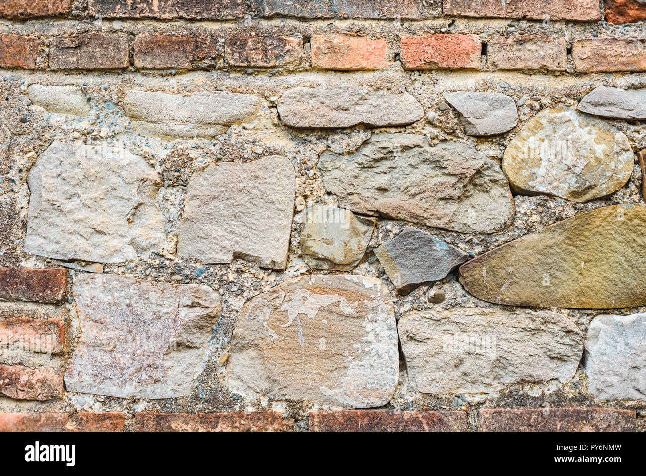Ancient wall from big colourful square brick stones Stock Photo - Alamy