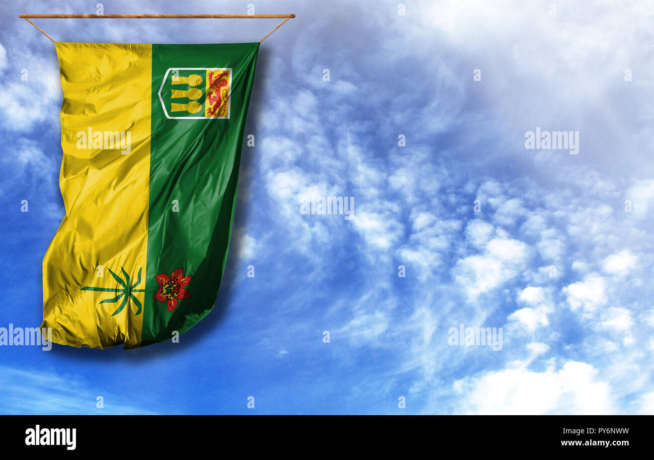 Flag of Saskatchewan. Vertical flag, against blue sky with place for ...