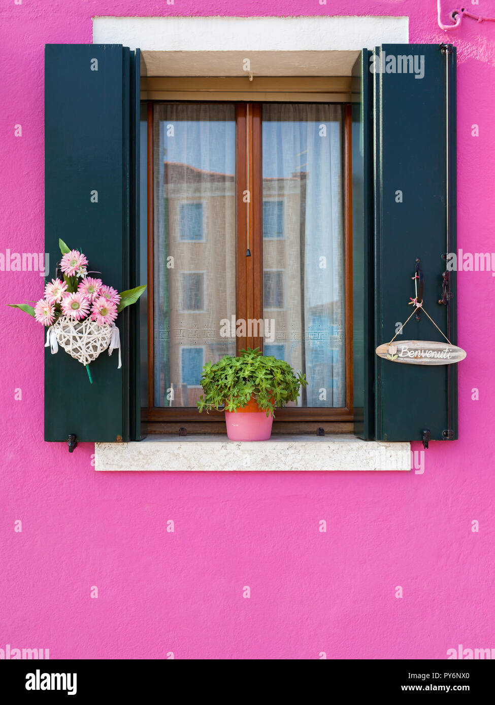 An open windowpane of a pink colored house Stock Photo - Alamy
