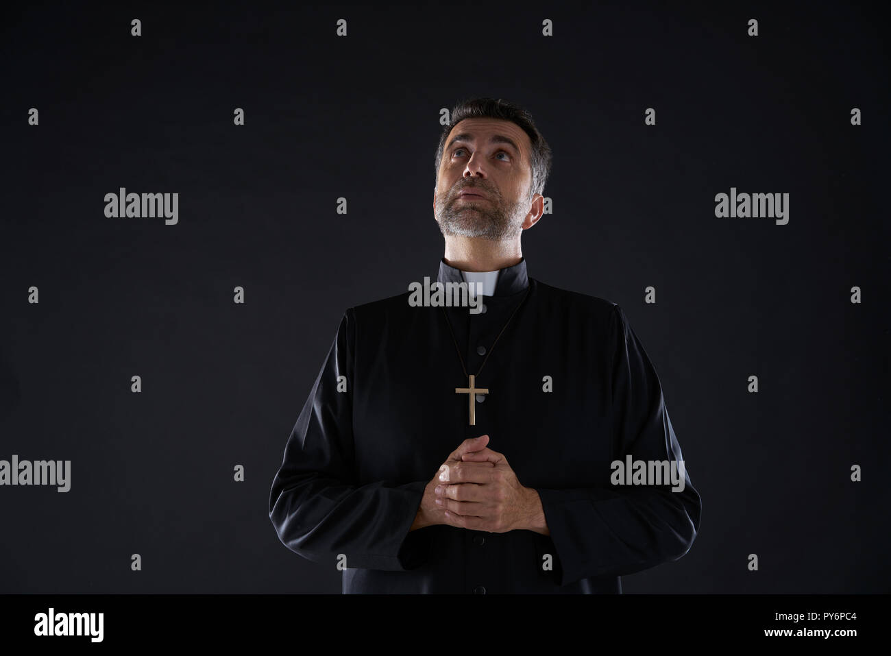 Priest looking up isolated hi-res stock photography and images - Alamy