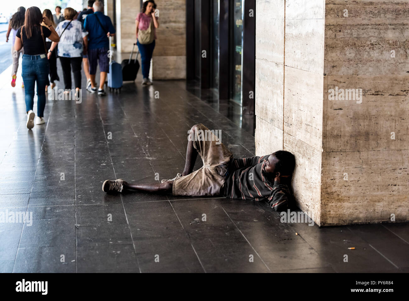 Homeless man lying train station hi-res stock photography and images ...