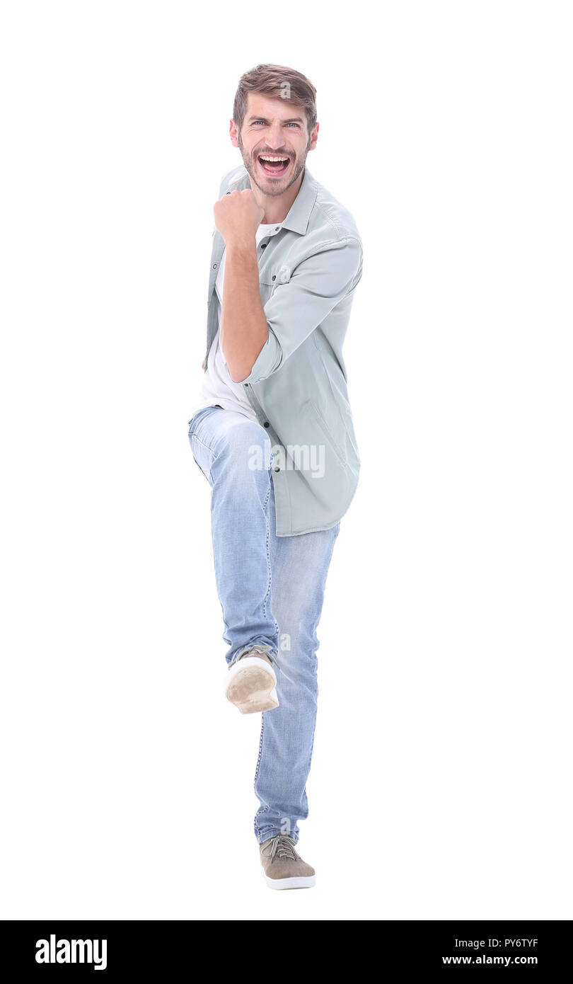 full-length. a happy young man steps forward Stock Photo - Alamy