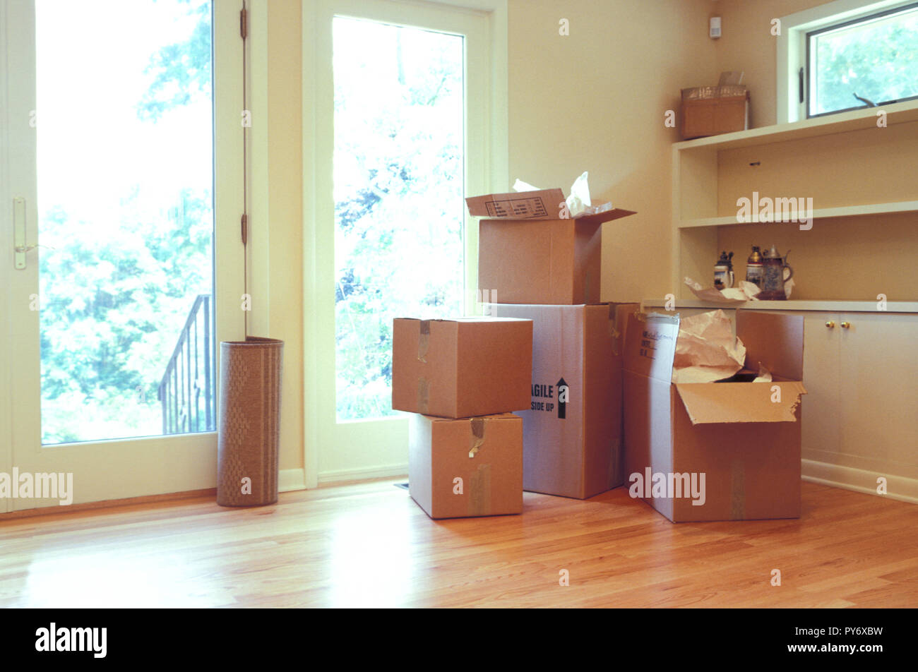 Cardboard packing boxes in suburban home on moving day, USA Stock Photo ...