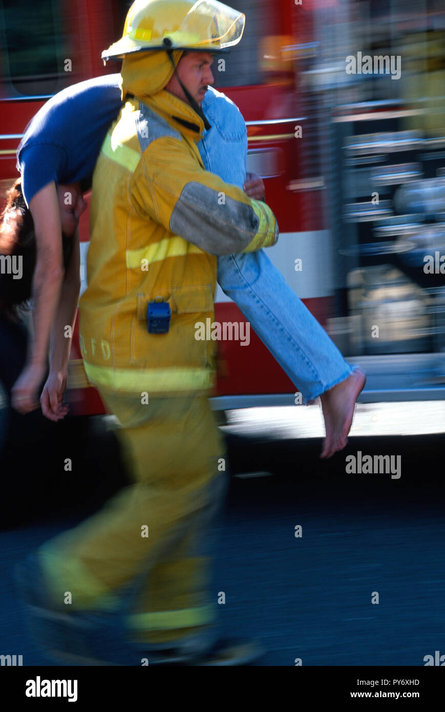 Fireman Rescuing a Young Girl at a Fire Scene, USA 1997 Stock Photo - Alamy