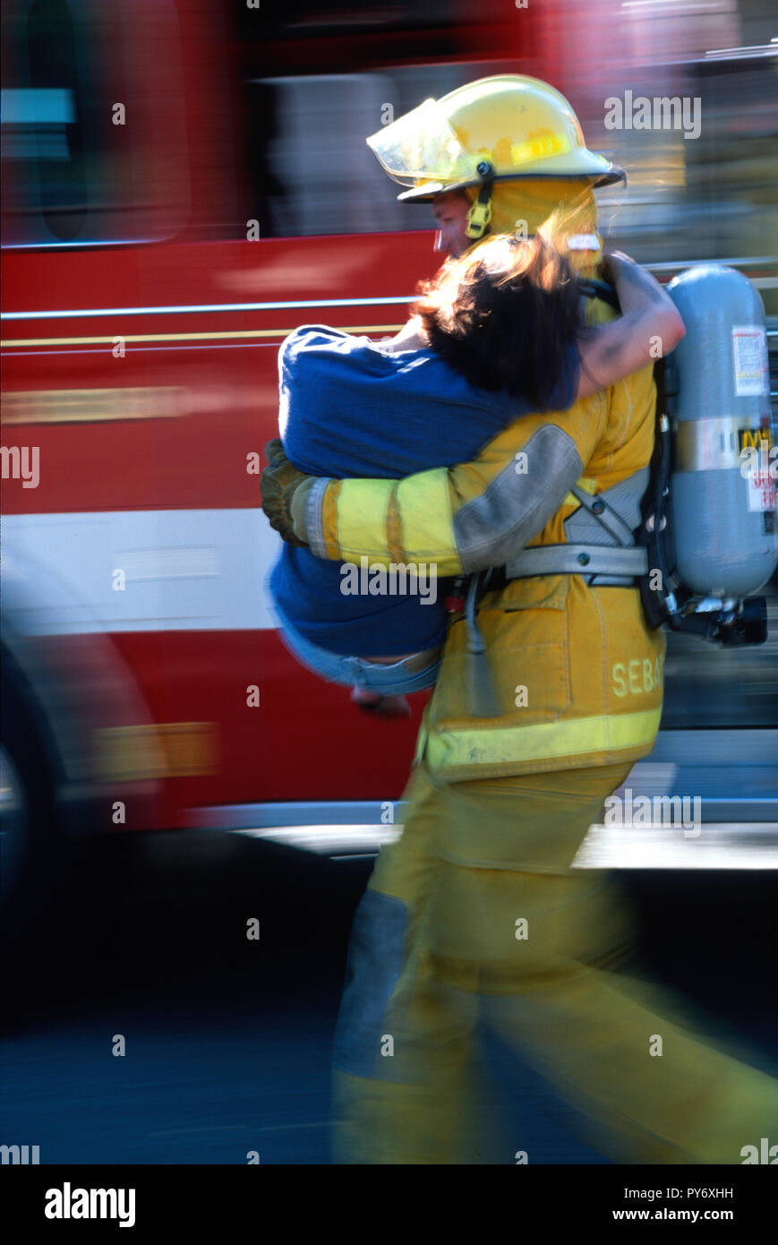 Fireman carrying woman hi-res stock photography and images - Alamy