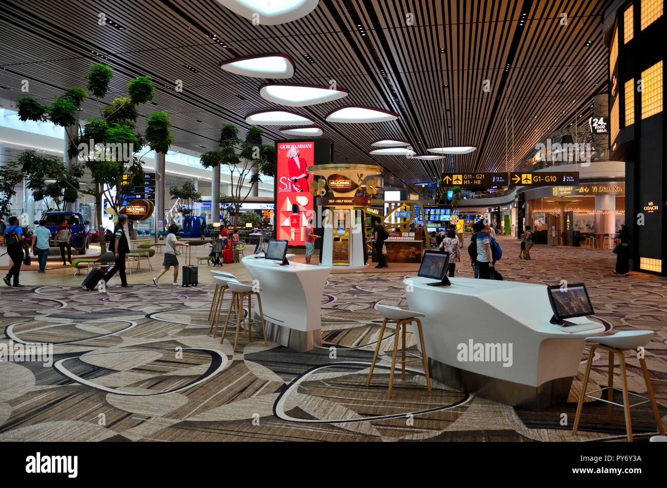 Travellers inside immigration area near departure gates at Changi T4 ...