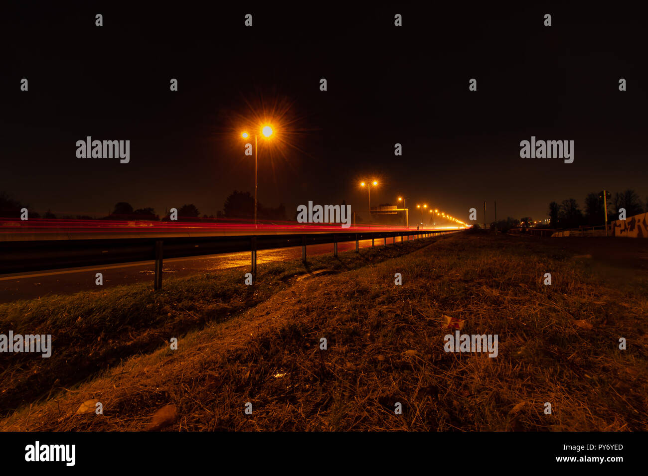 Highway at night with light trails Stock Photo - Alamy