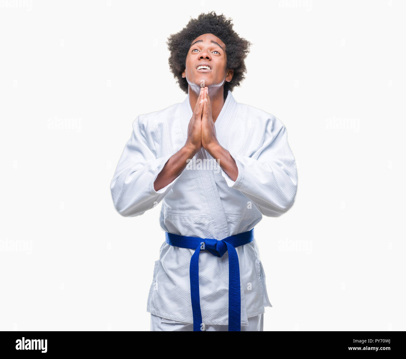 Afro american man wearing karate kimono over isolated background ...
